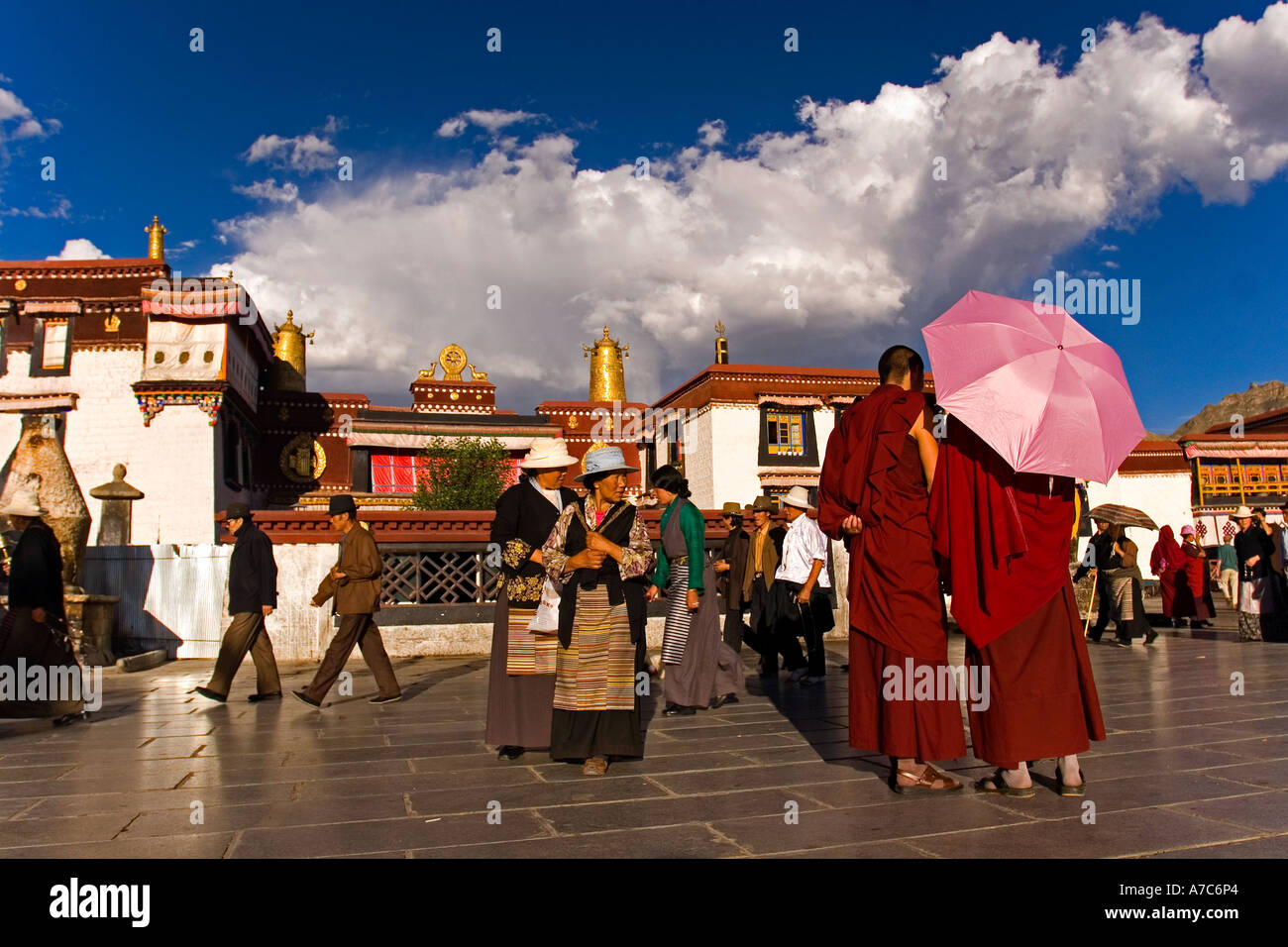 Monks pilgrim and tourist in front of the Jhokang temple in old Lhasa ...