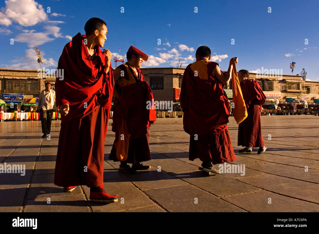 Monks pilgrim and tourist in front of the Jhokang temple in old Lhasa ...