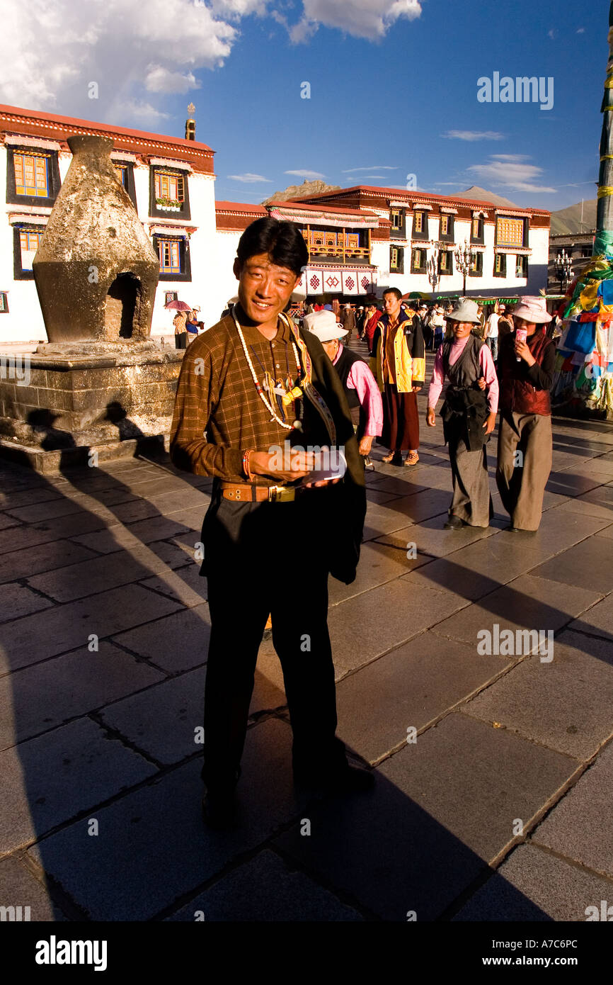 Monks pilgrim and tourist in front of the Jhokang temple in old Lhasa ...