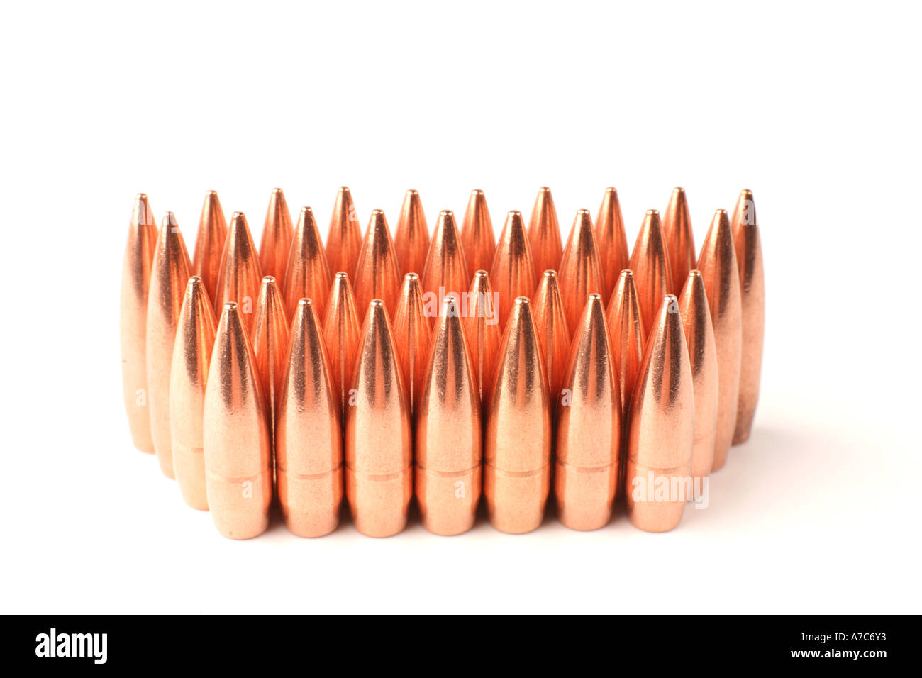 Group of bullets standing in rows. 308 rifle bullets arranged in rows ...