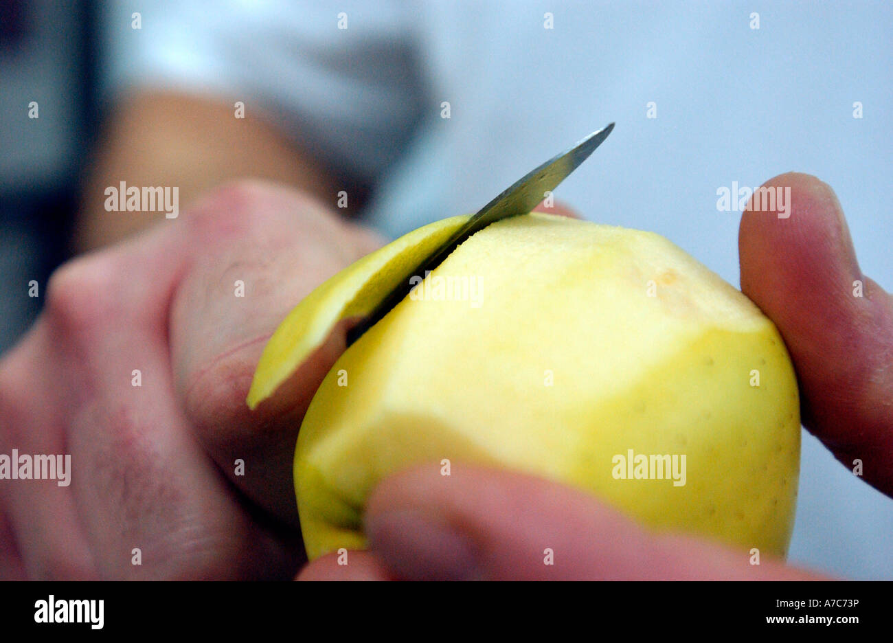 Peeling an apple with a knife Stock Photo - Alamy