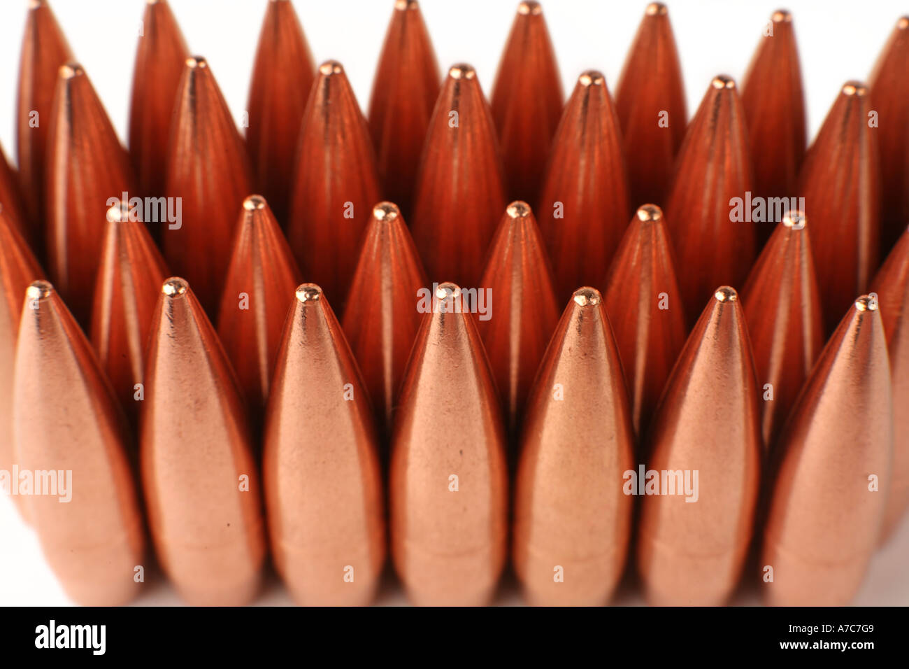 Group of bullets standing in rows. 308 rifle bullets arranged in rows ...