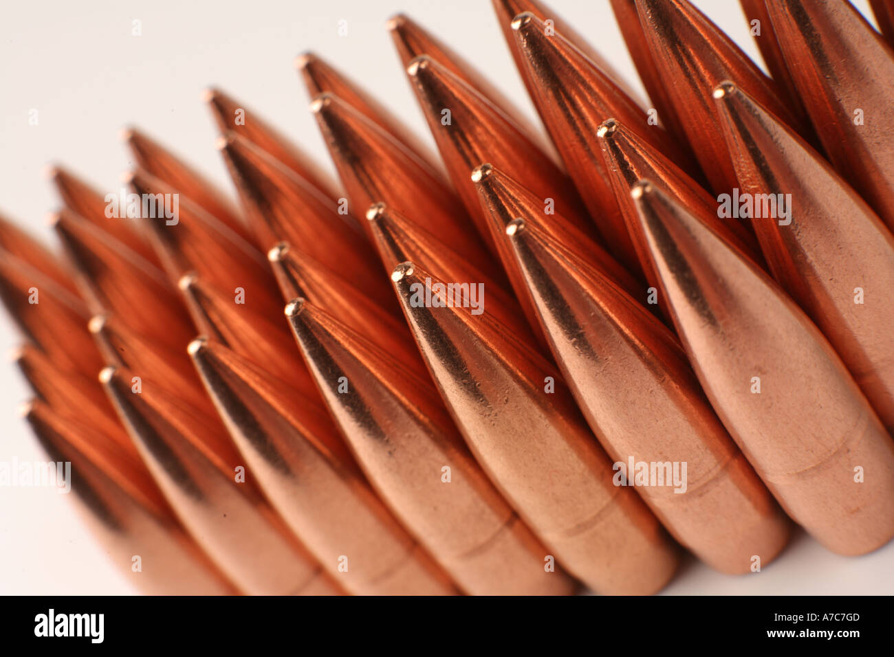 Group of bullets standing in rows. 308 rifle bullets arranged in rows ...