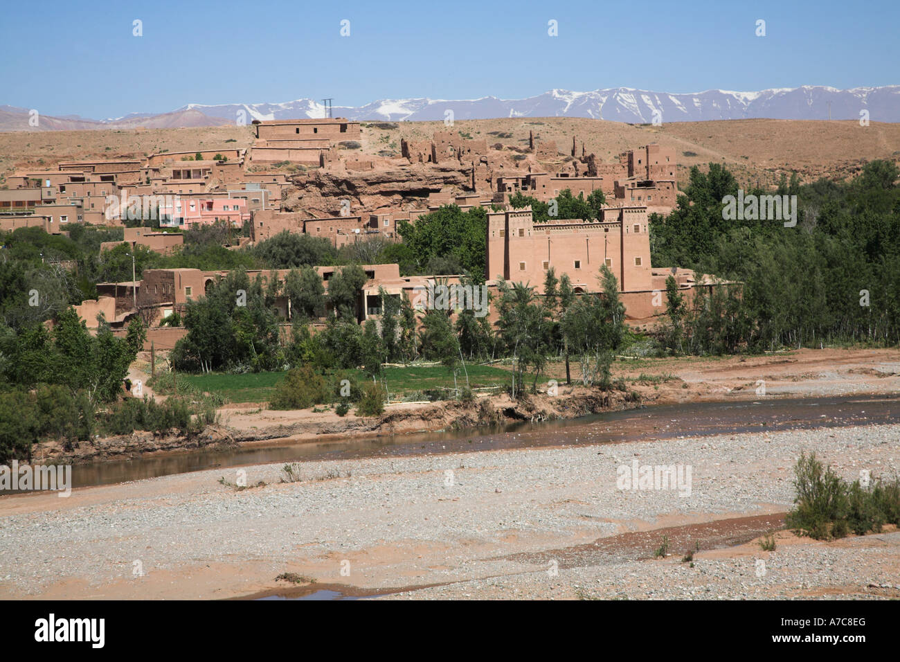 Kalaat M'Gouna with river and snowy peaks of Atlas Mountains, Ourzazate ...