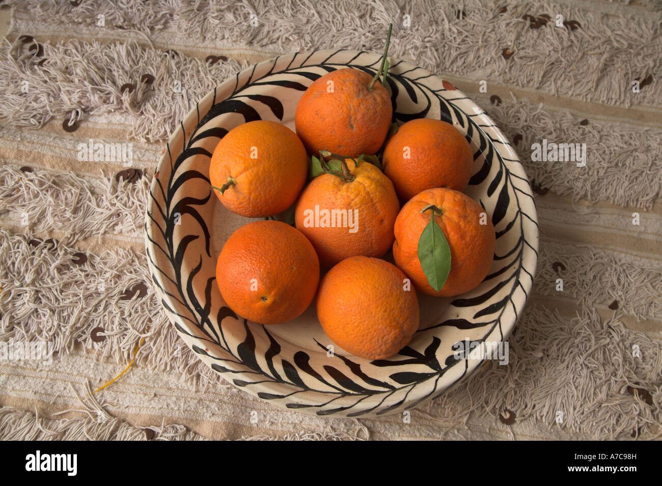 Bowl of fresh oranges in a bowl on carpet Morocco Stock Photo - Alamy