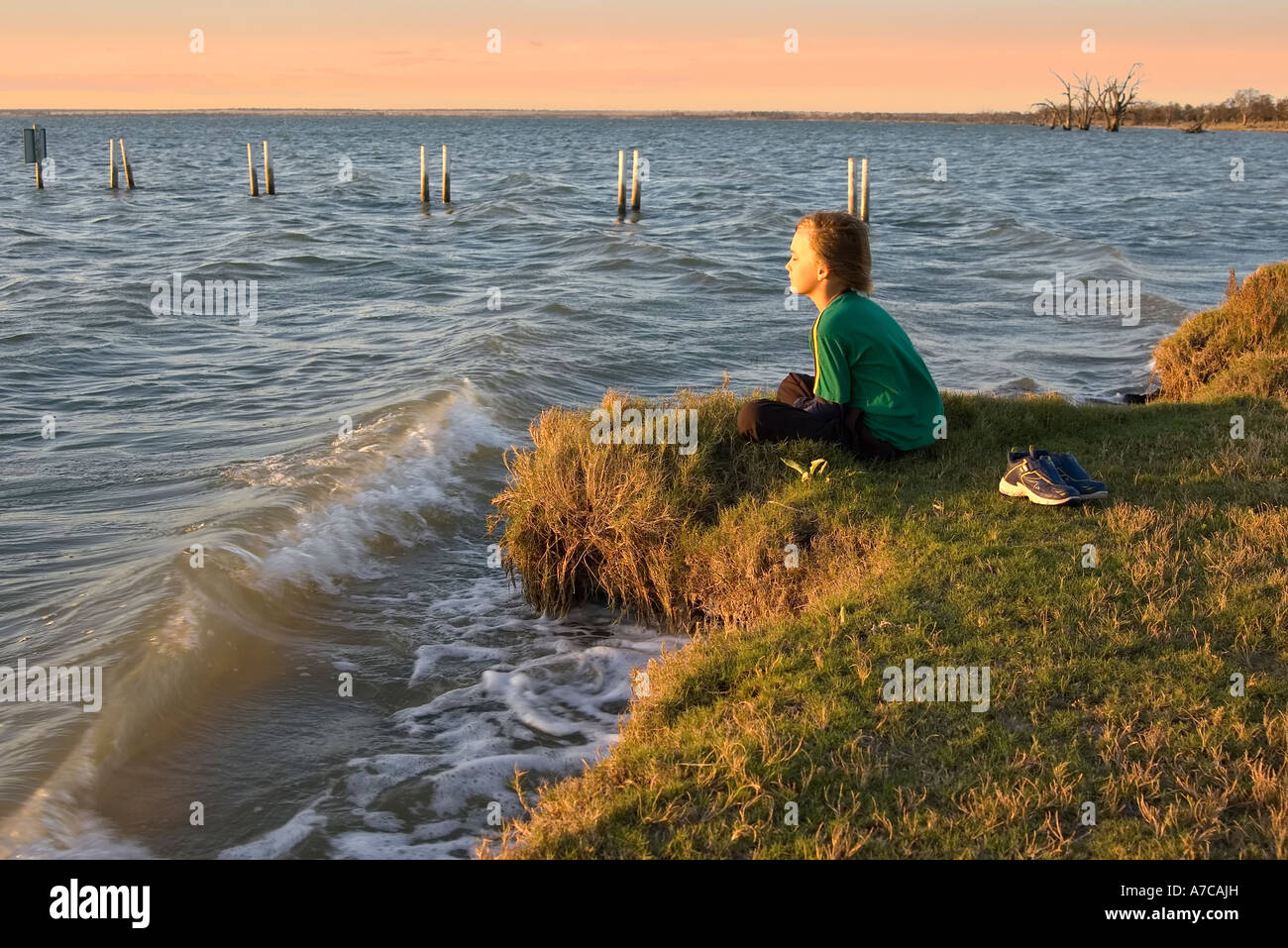 look looking sit water sea lake wistful boy person yearn sunset sunrise ...