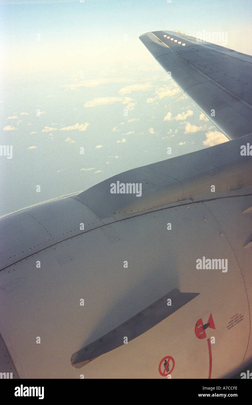 Airplane wing and reactor in the air Stock Photo - Alamy