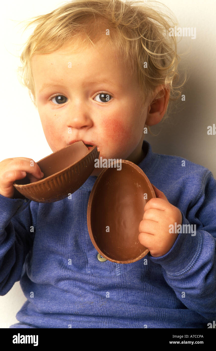 Children eating chocolate easter eggs hi-res stock photography and ...