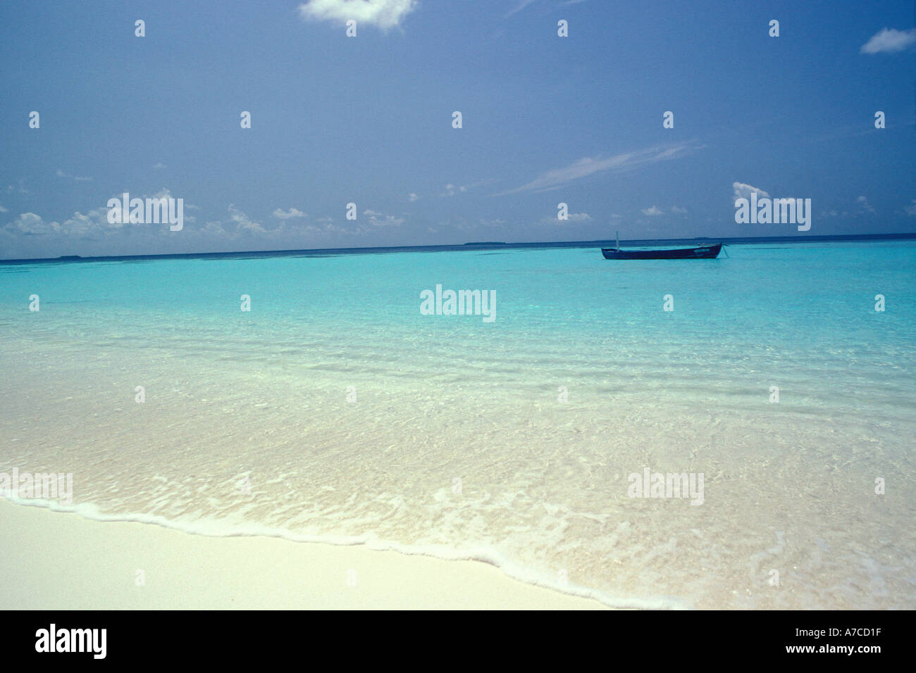 Beach little boat and blue sky, Maldives Island Stock Photo - Alamy