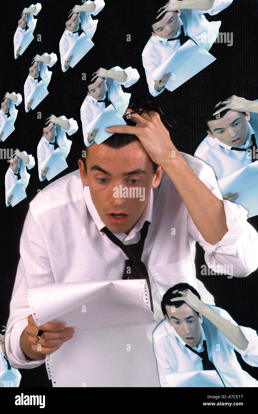 Stressed executive reading document Stock Photo - Alamy