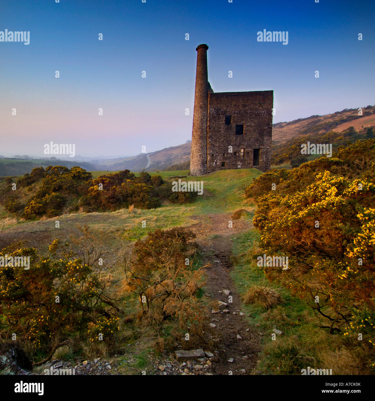 Derelict mine engine Wheal Betsy near Tavistock illuminated by early ...