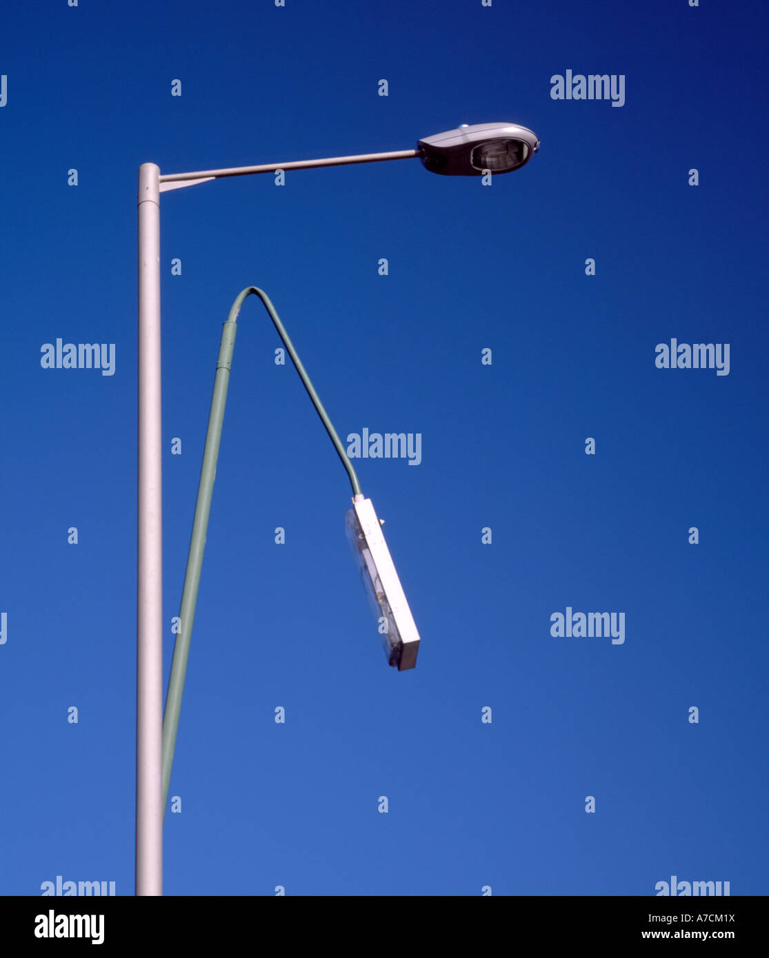 Bent lamp post and replacement Stock Photo - Alamy