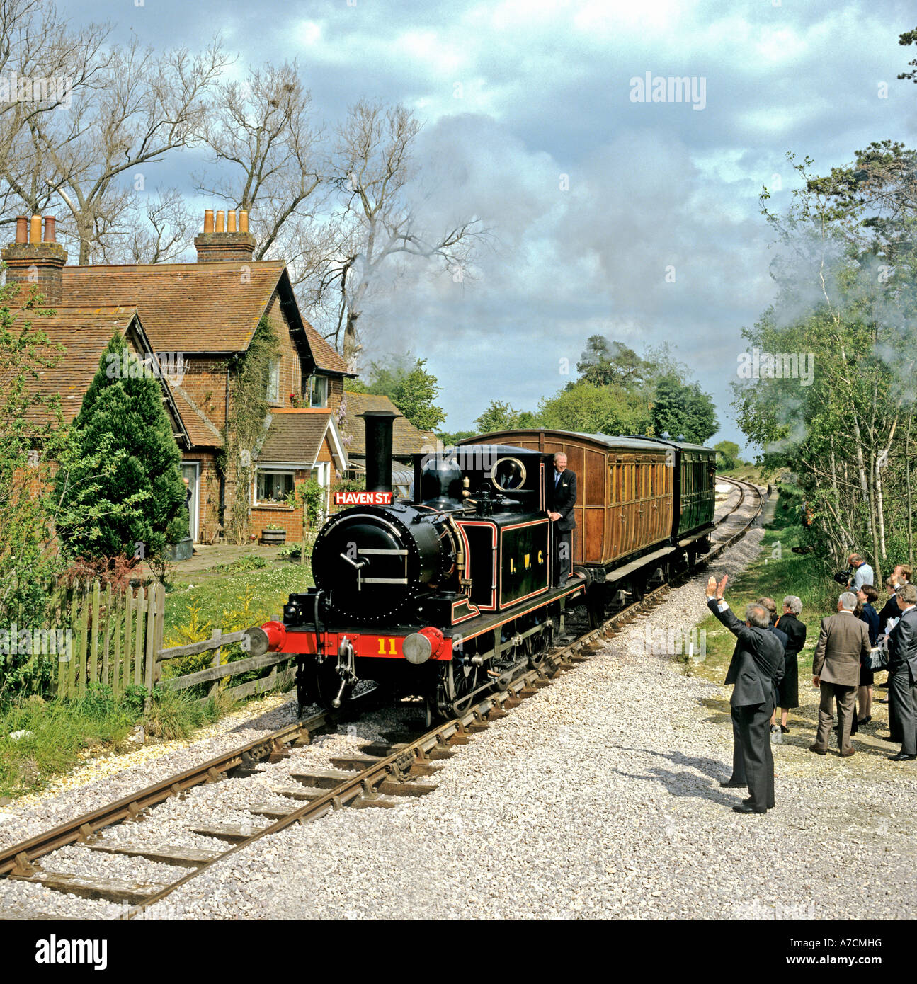 Lord Shuttleworth on footplate of 0 6 0T steam passenger train at Ashey ...