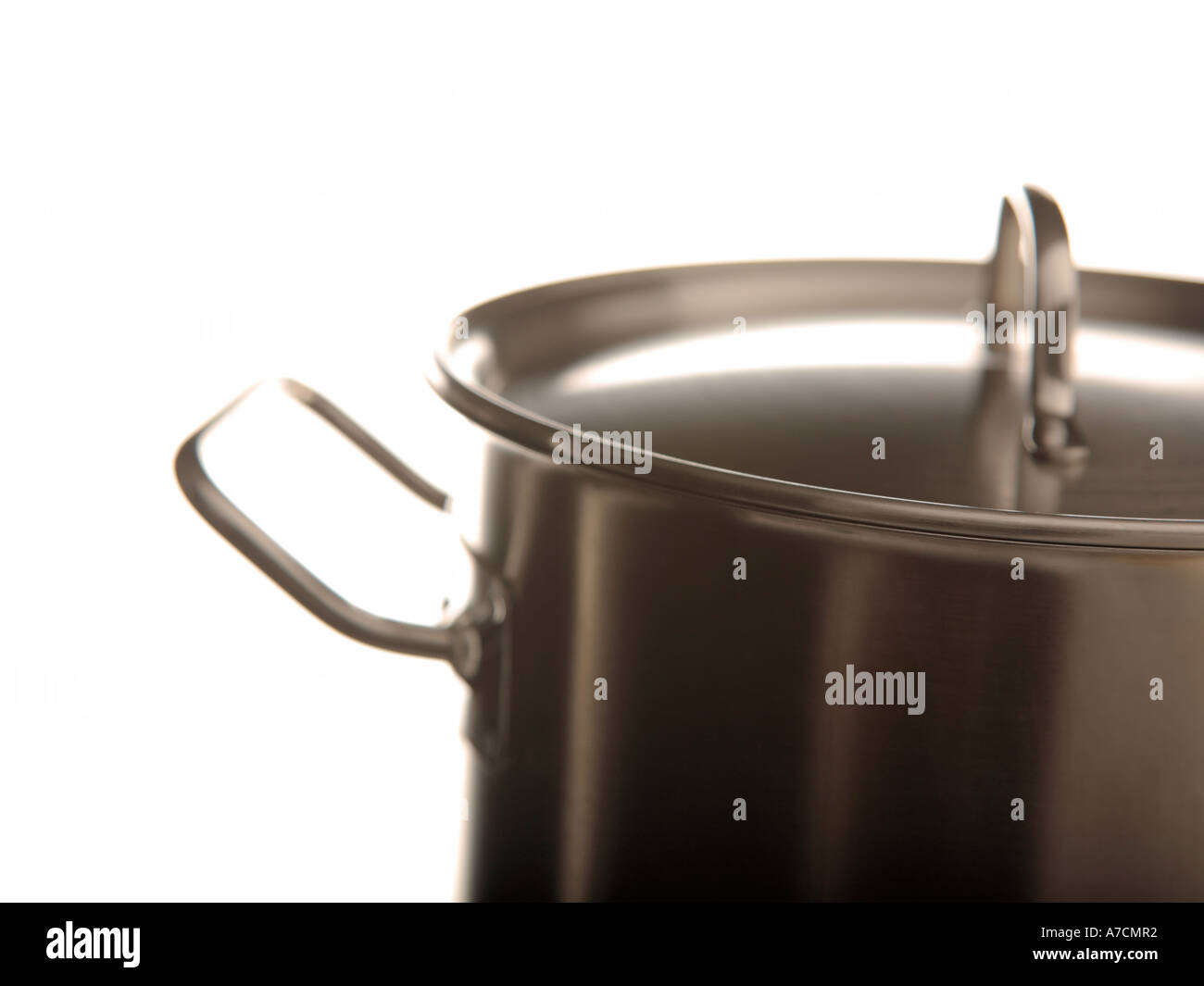 Stainless steel pan with lid on white background - high key lighting ...