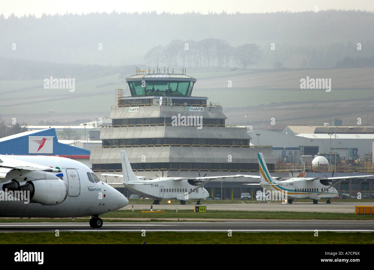 Aircraft pass the control tower at Aberdeen Airport, Scotland UK Stock ...