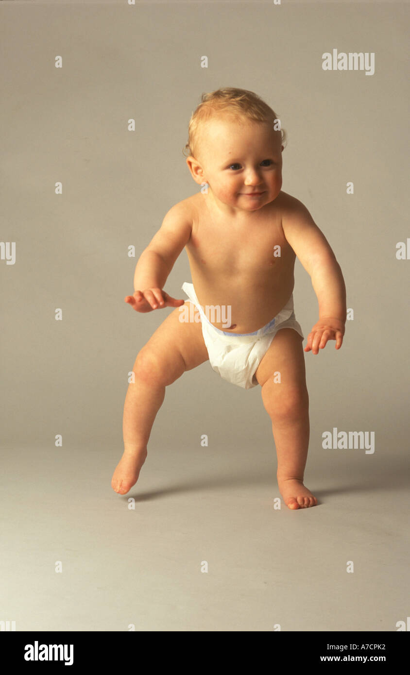 baby taking its first steps Stock Photo - Alamy