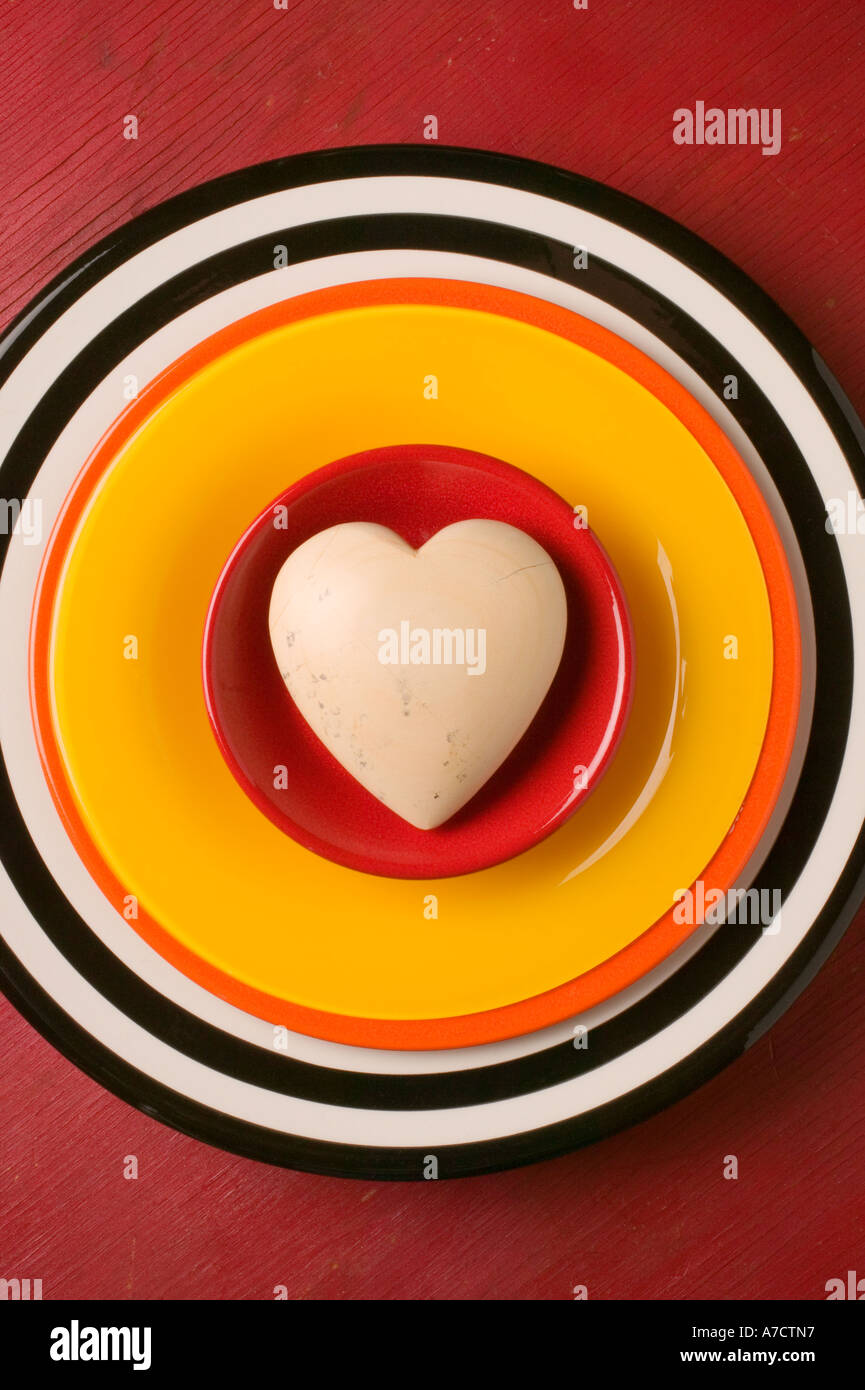 White stone heart in dish Stock Photo - Alamy