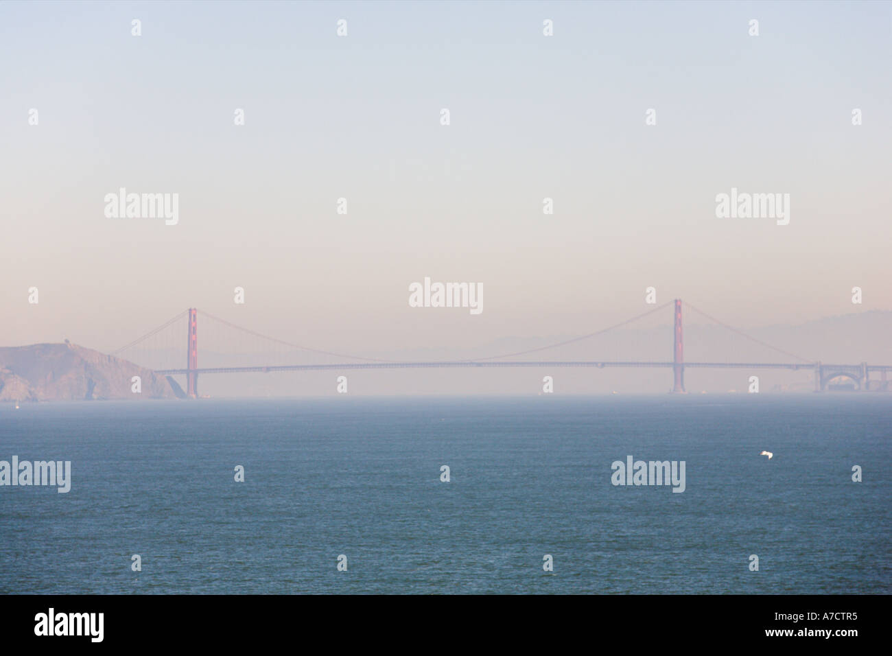 Approaching the distinctive Golden Gate Bridge shrouded in mist from ...