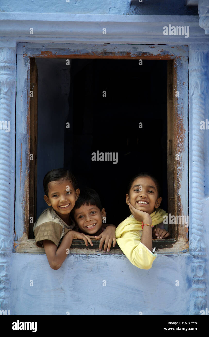 Children looking out a window in Jodhpur India Stock Photo - Alamy