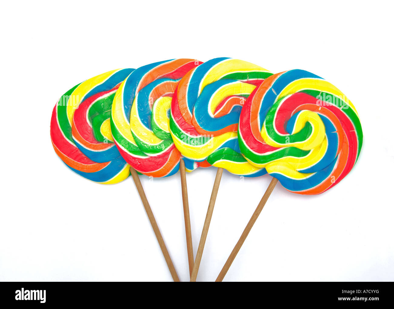 four lollipops laid out on white background Stock Photo - Alamy