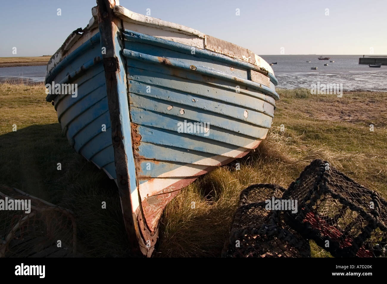 Bow of an old rowing boat and lobster pots Stock Photo - Alamy