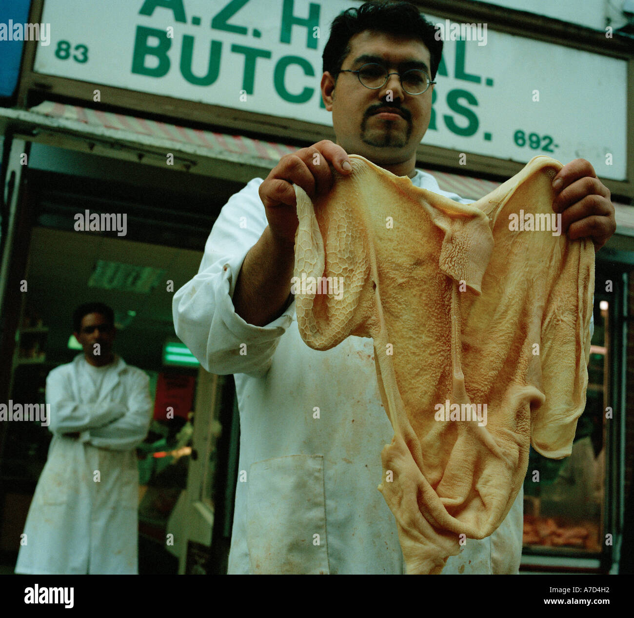 Halal butcher in London holding a goat's stomach Stock Photo - Alamy