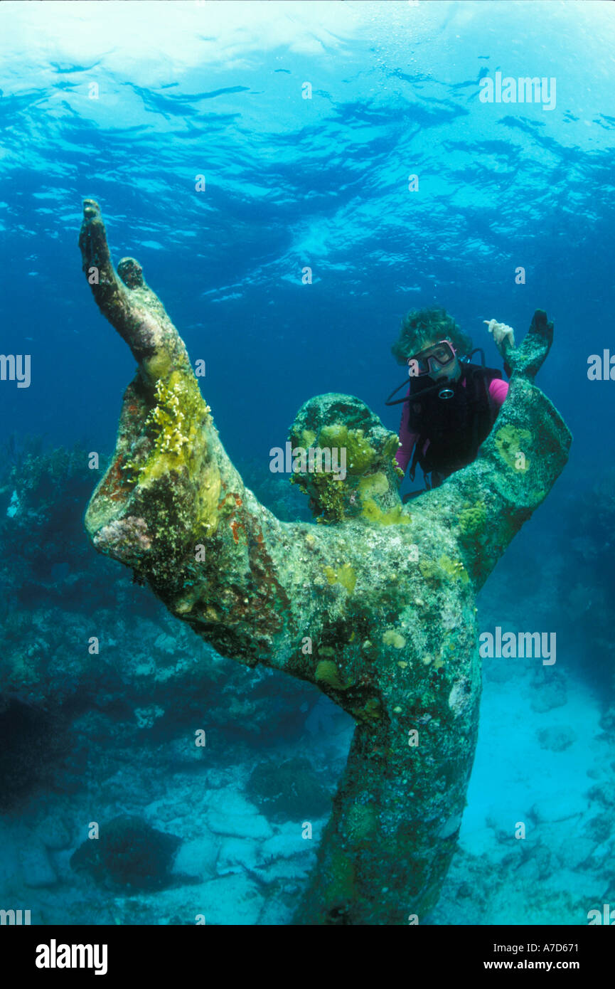 A SCUBA DIVER WITH THE STATUE OF CHRIST OF THE ABYSS KEY LARGO FLORIDA ...