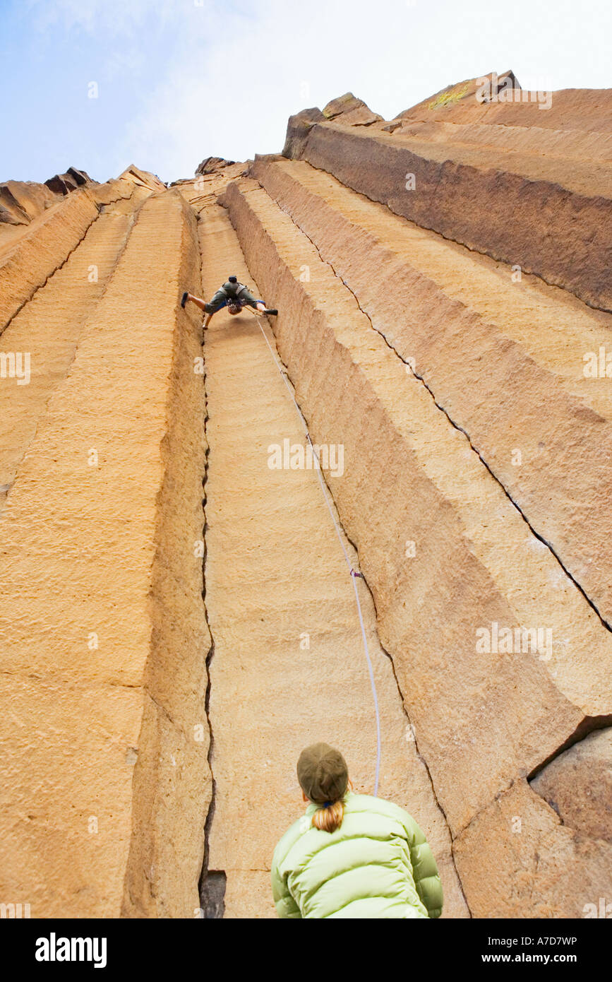Woman climbing basalt rock hi-res stock photography and images - Alamy
