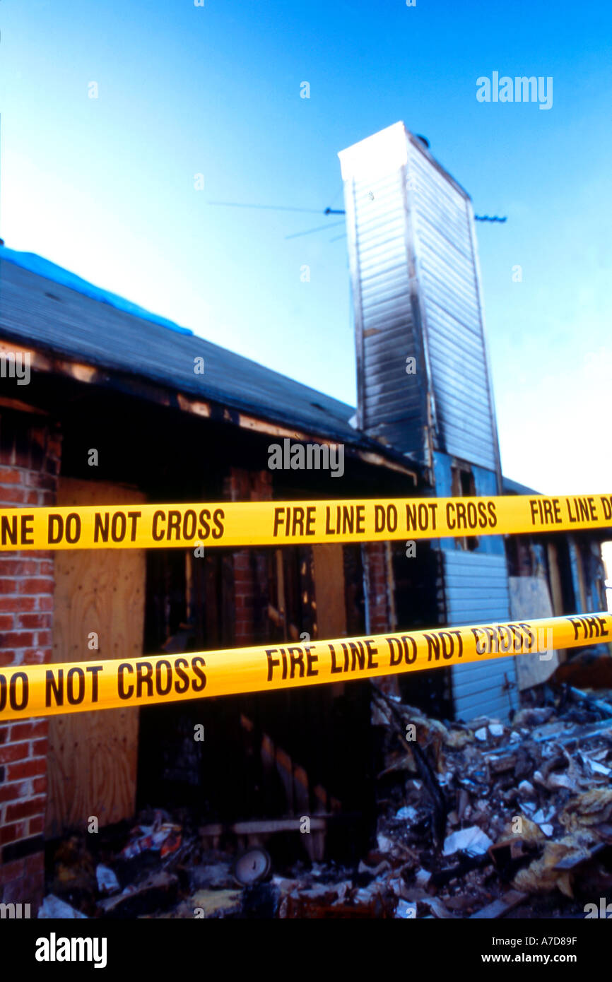 Yellow warning tape after house fire Stock Photo - Alamy