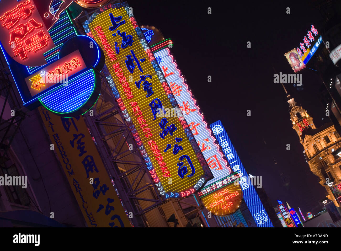 Asia China Shanghai Neon signs line storefronts along Nanjing Road a ...