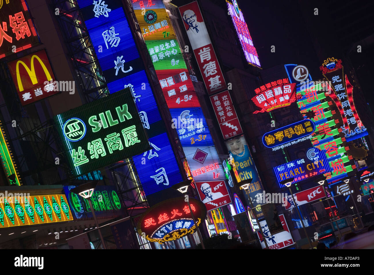 Asia China Shanghai Neon signs line storefronts along Nanjing Road a ...
