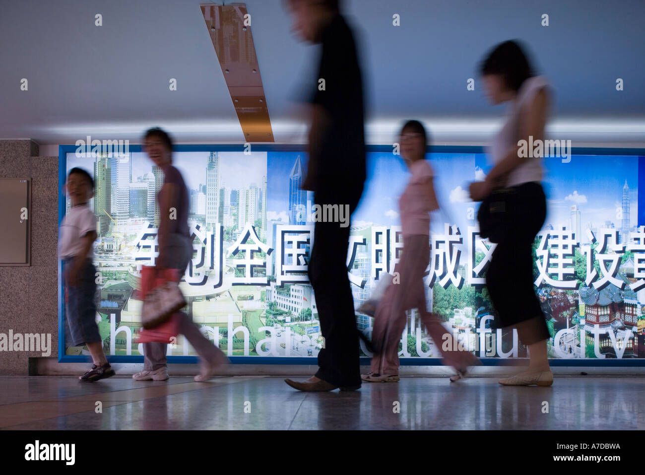 Asia China Shanghai Pedestrians walk past signboard showing Shanghai ...