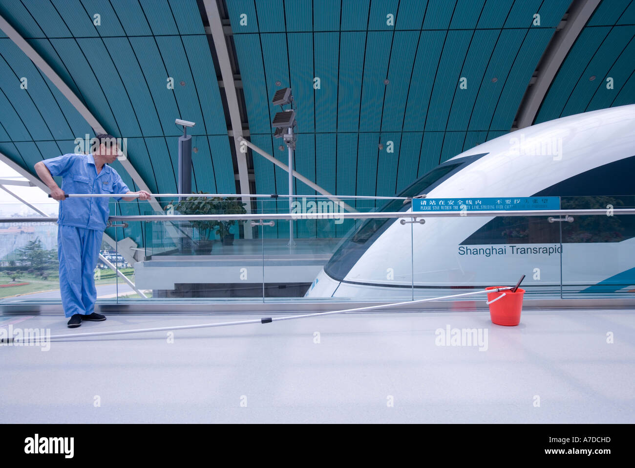 Asia China Shanghai Worker cleans splattered bugs from windshield of ...
