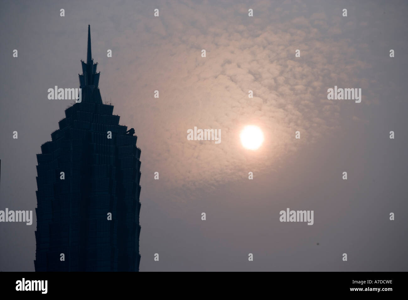 Asia China Shanghai Silhouette Jin Mao Tower and rising sun along ...