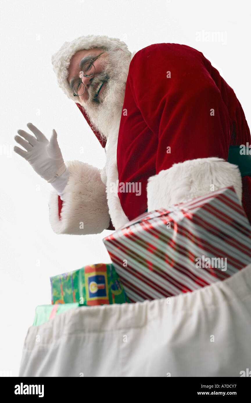 Santa claus giving presents hi-res stock photography and images - Alamy
