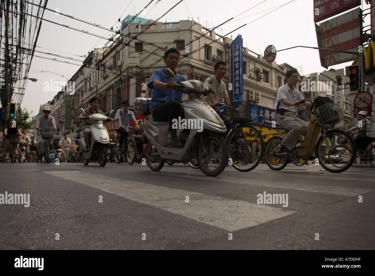Asia China Shanghai Crowd of bicyclists and motor scooters fill streets ...