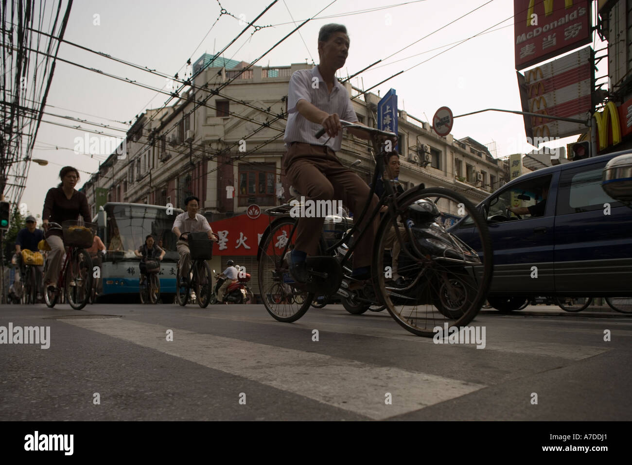 Asia China Shanghai Crowd of bicyclists and motor scooters fill streets ...