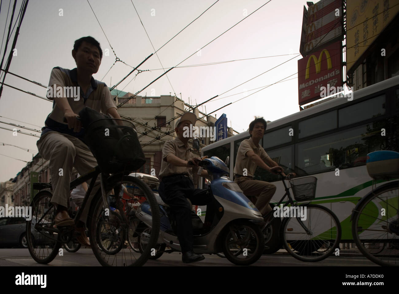 Asia China Shanghai Crowd of bicyclists and motor scooters fill streets ...