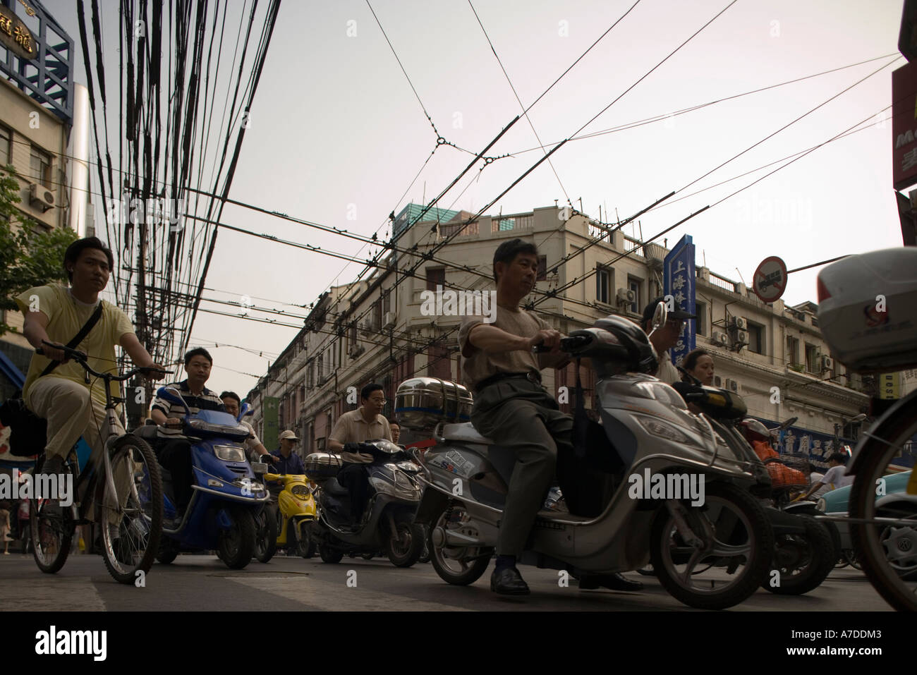 Asia China Shanghai Crowd of bicyclists and motor scooters fill streets ...
