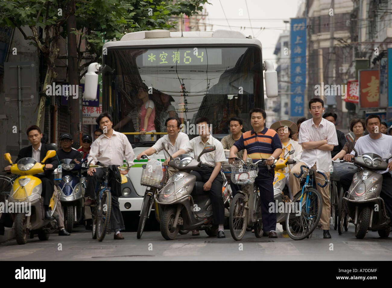 Asia China Shanghai Crowd of bicyclists and motor scooters fill streets ...