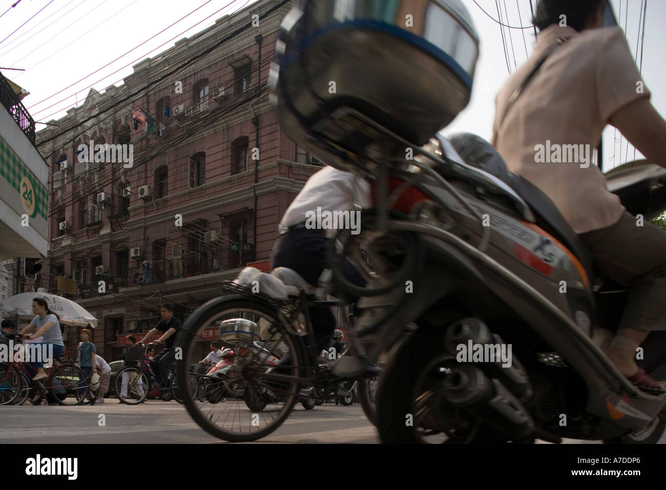 Asia China Shanghai Crowd of bicyclists and motor scooters fill streets ...