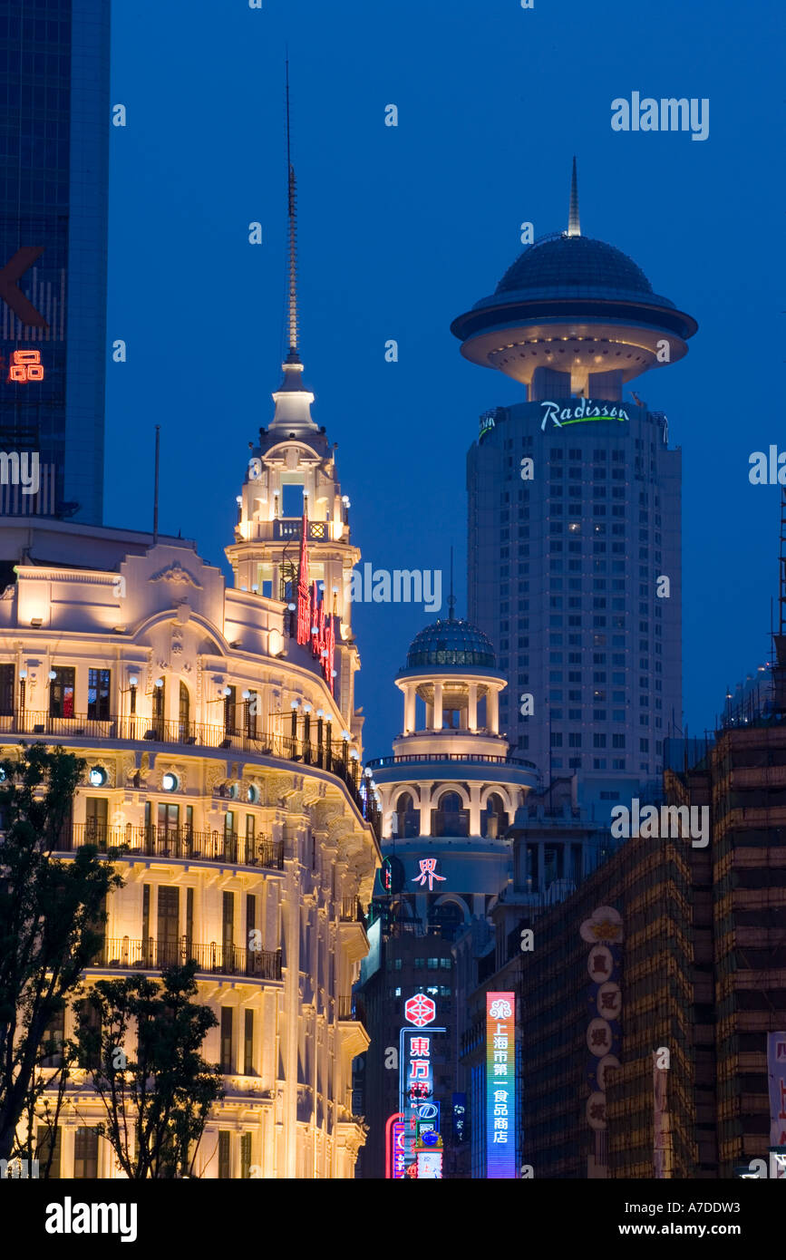 Asia China Shanghai The Radisson Hotel rises above neon lit shopping ...