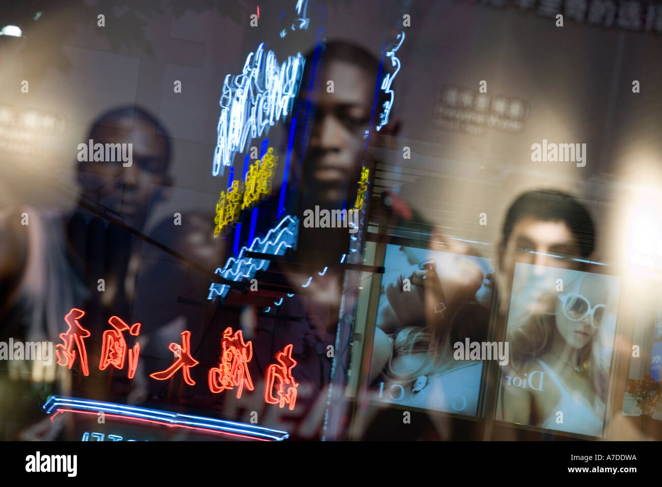 Asia China Shanghai Reflection of neon signs in poster of American NBA ...