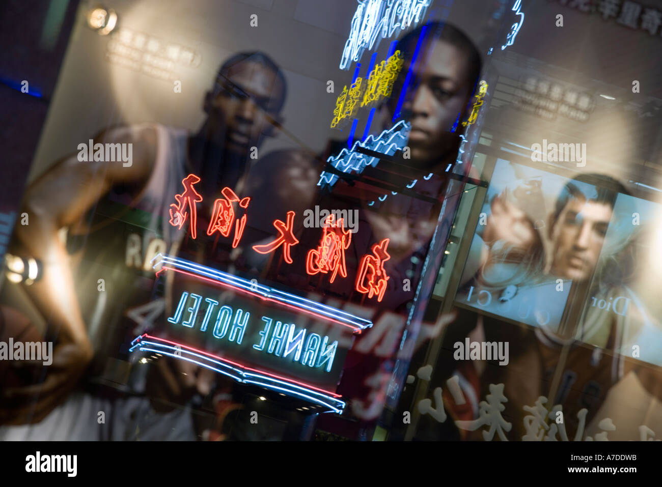 Asia China Shanghai Reflection of neon signs in poster of American NBA ...