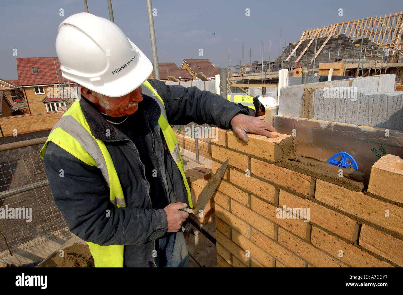 Bricklayer laying course bricks hi-res stock photography and images - Alamy