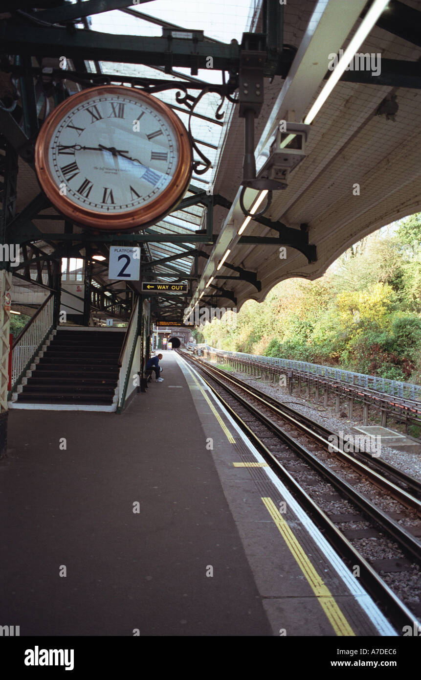Empty London Underground station with clock Stock Photo - Alamy