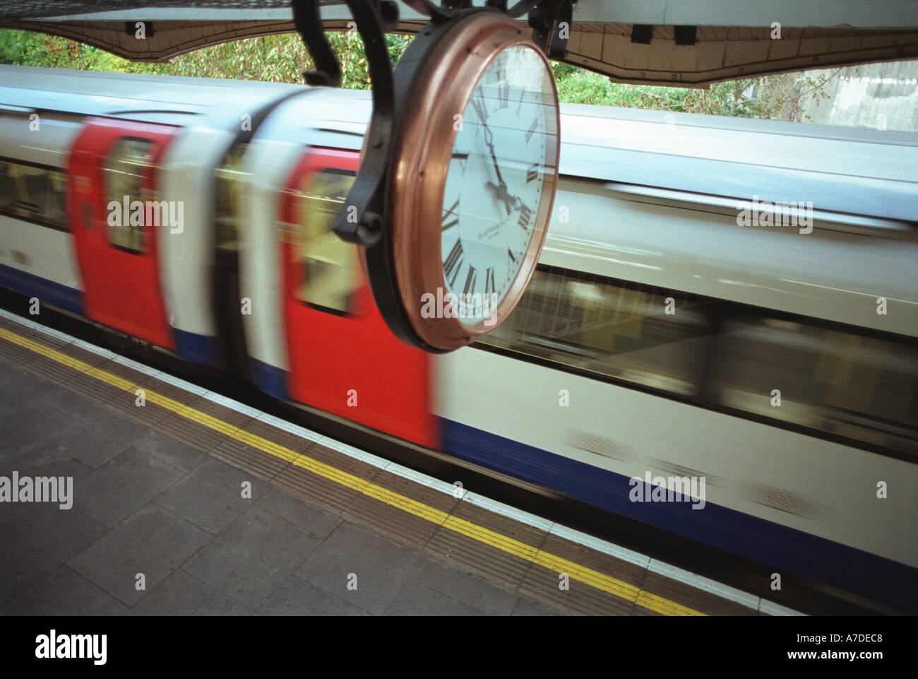 Train moving through London Underground station Stock Photo - Alamy