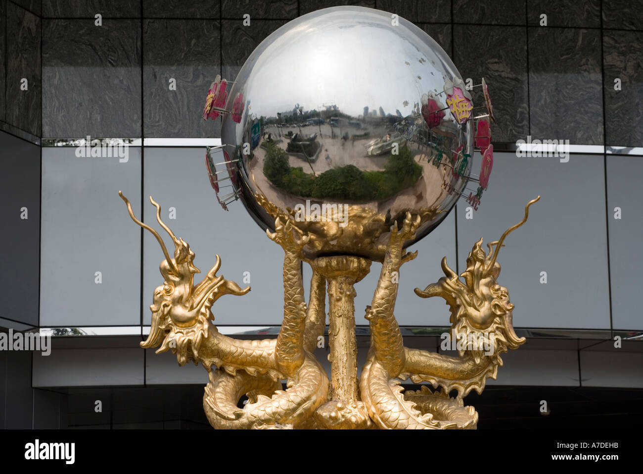 Asia China Shanghai Sculpture of dragons holding reflecting steel ...