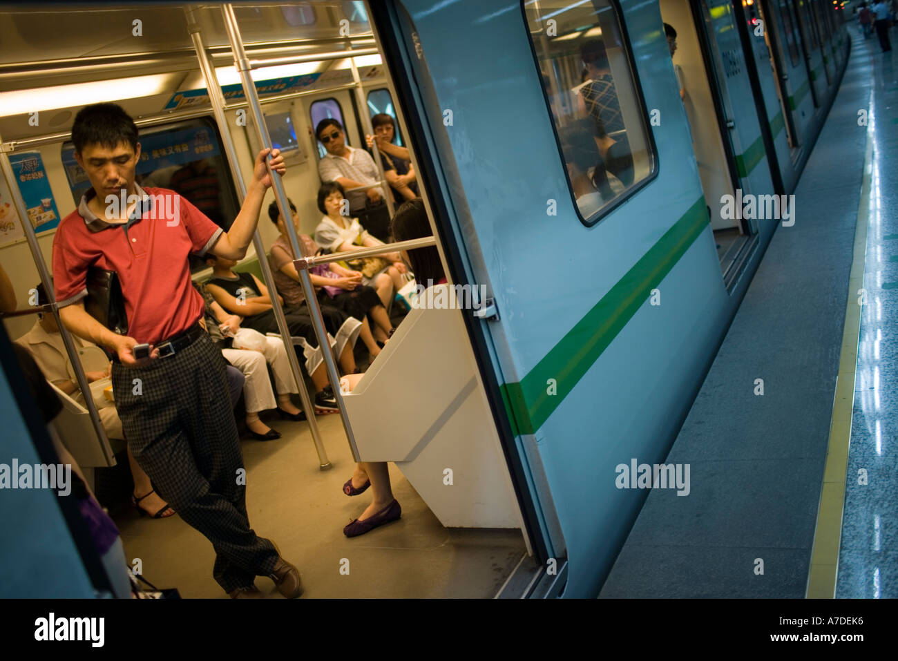 Asia China Shanghai Passengers on crowded Metro subway train during ...
