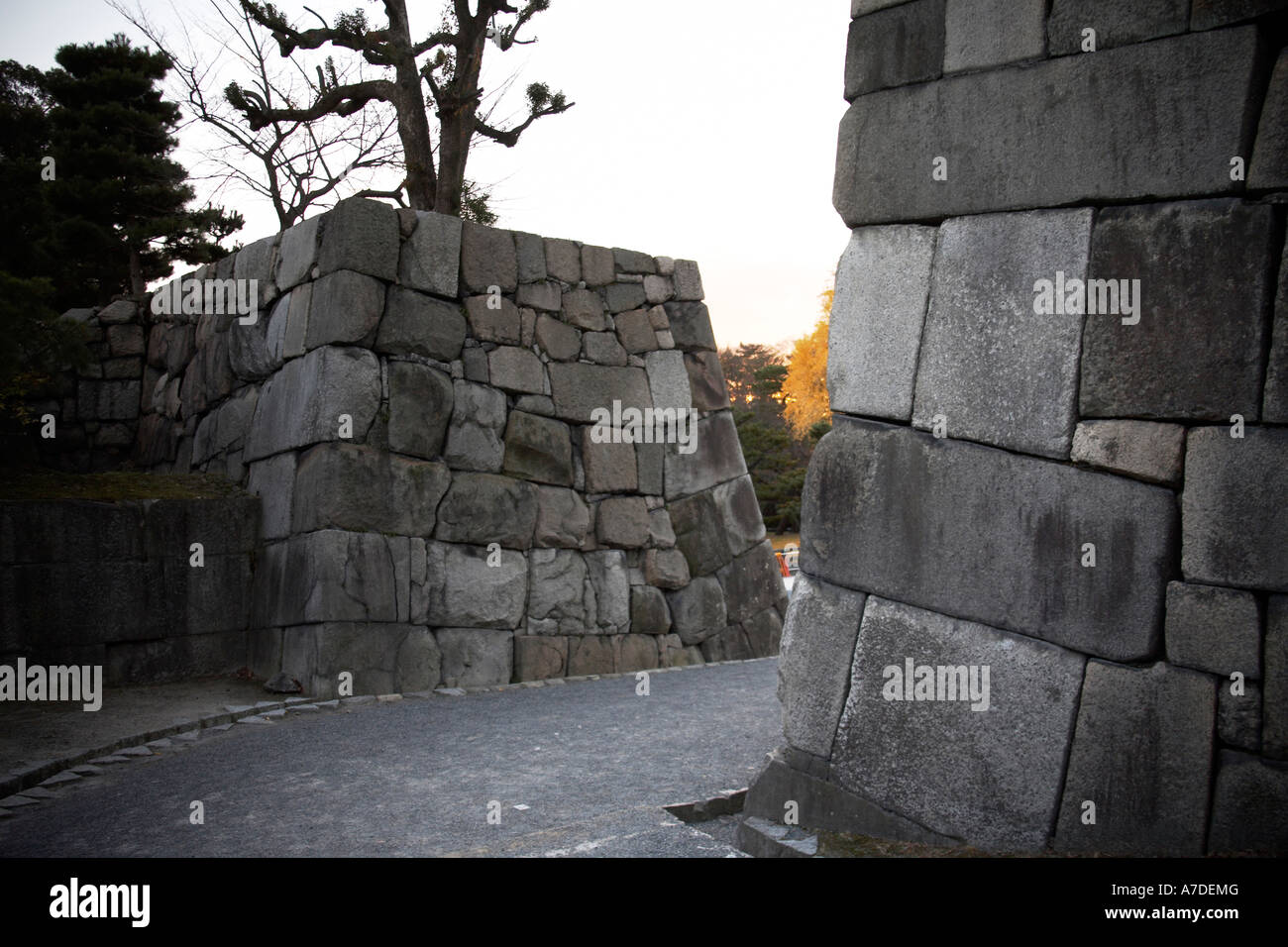 Sloping hand cut stone block outer walls at entrance of Nijo Castle ...